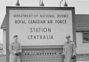 Two Men Outside RCAF Station Centralia Sign – New United Goderich